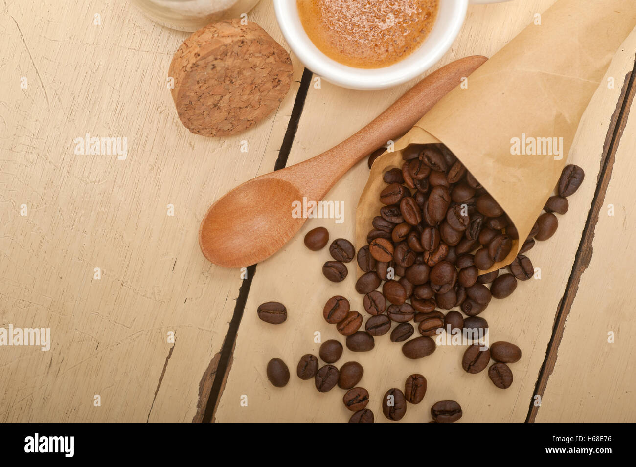 espresso coffee and beans on a paper cone cornucopia over white ...
