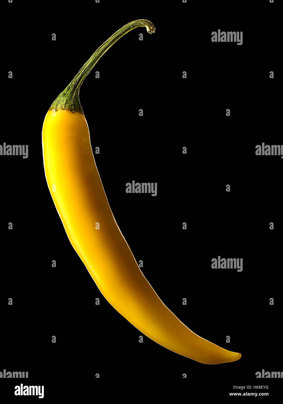 Yellow chilli pepper isolated on black background Stock Photo - Alamy