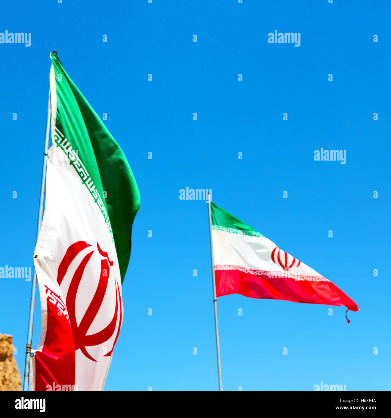 in iran blur iranian waving flag the blue sky and wind Stock Photo - Alamy