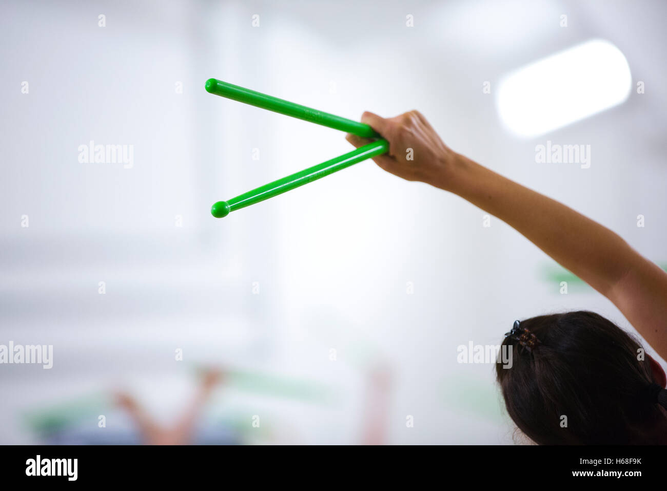 Women participating in POUND fitness class, hour long workout drumming ...