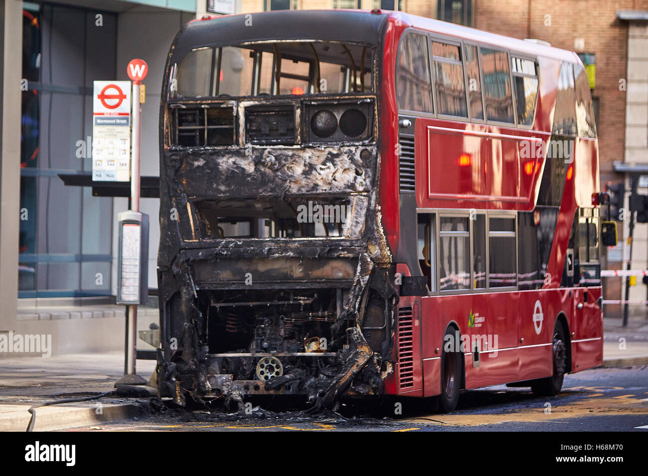 A fire-damaged bus in Bishopsgate, London Stock Photo - Alamy