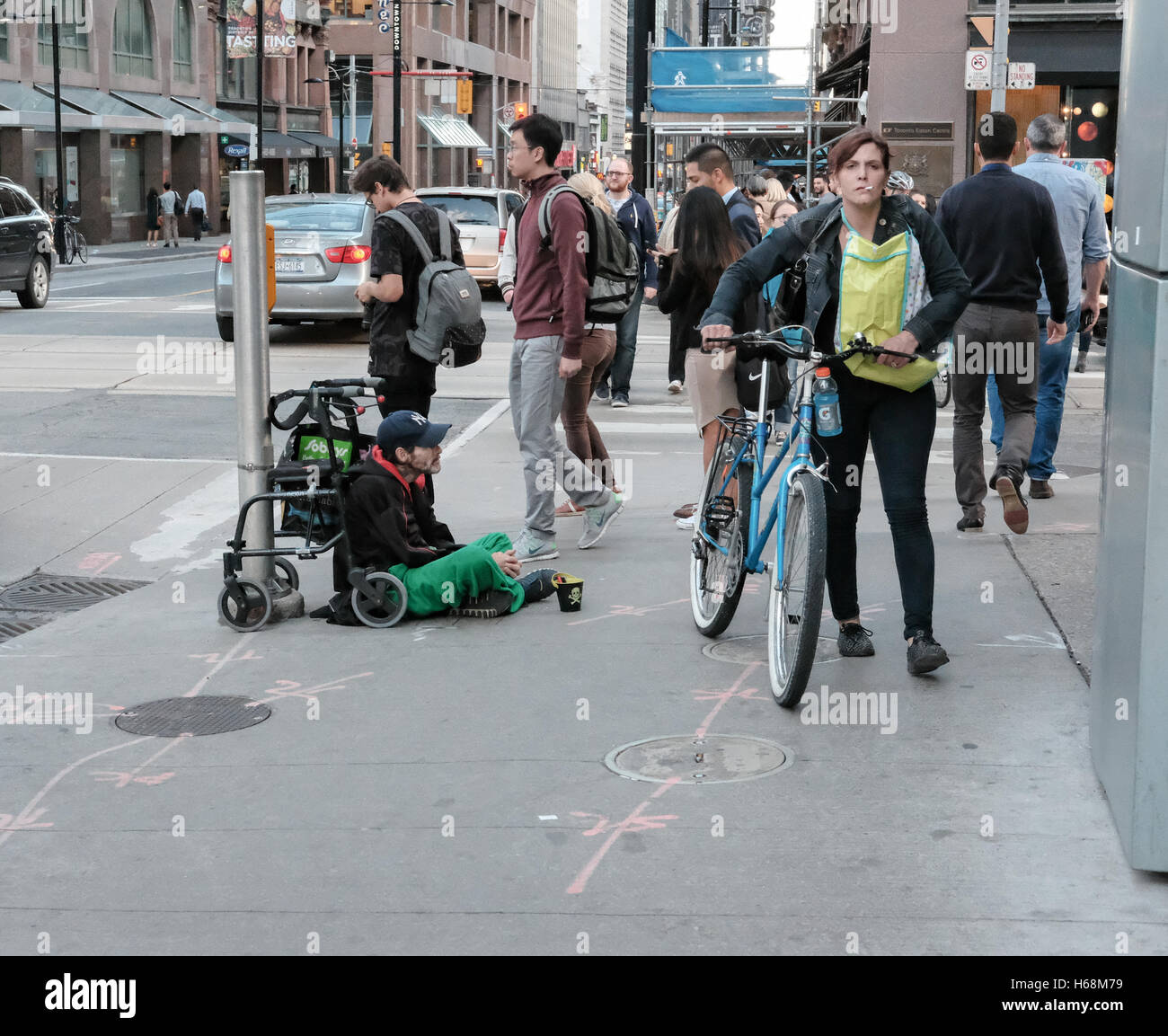 Disabled homeless man seen in front of his disabled chair, looking for ...