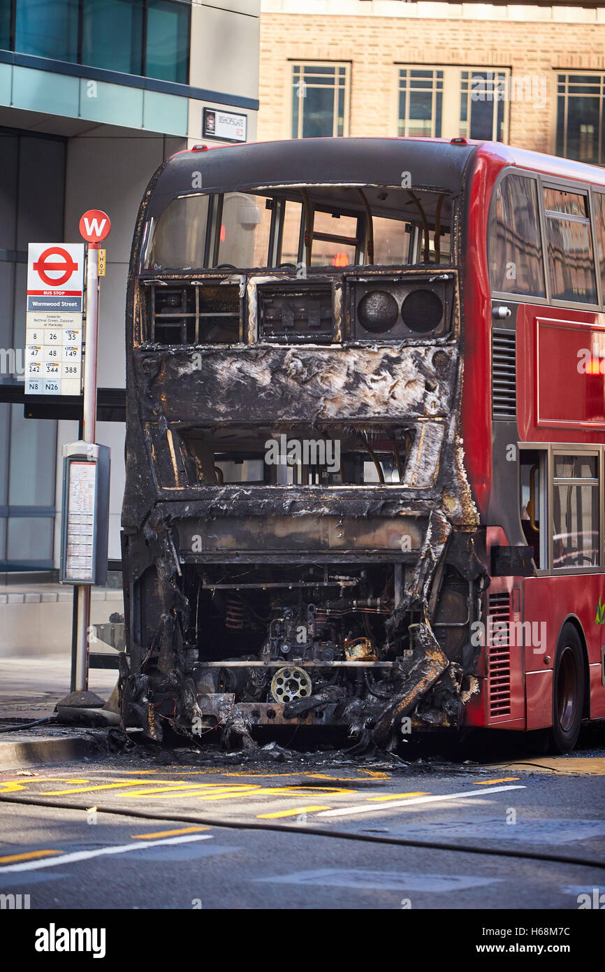 A fire-damaged bus in Bishopsgate, London Stock Photo - Alamy
