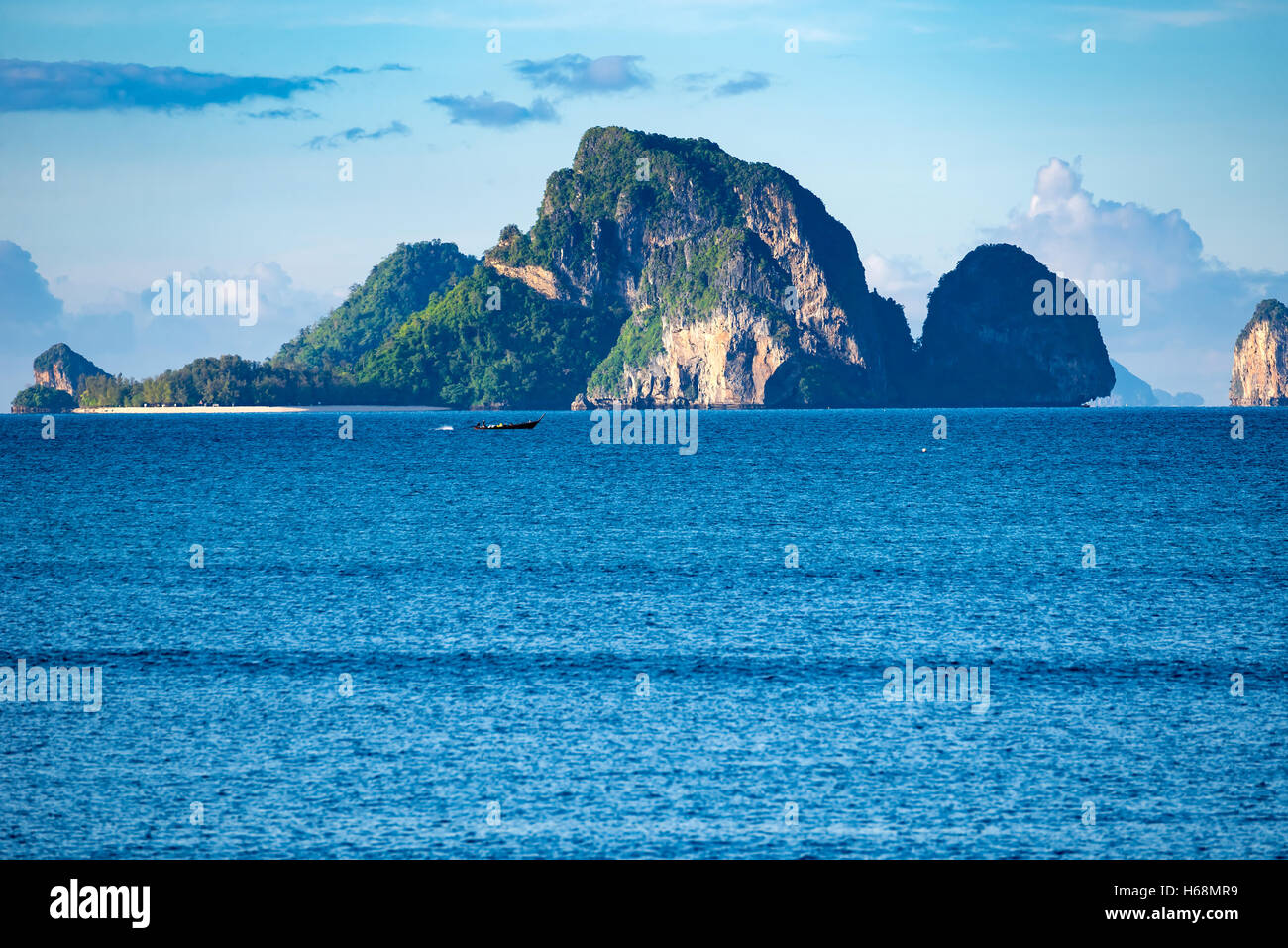 Tropical beach and island with blue sky background Stock Photo - Alamy