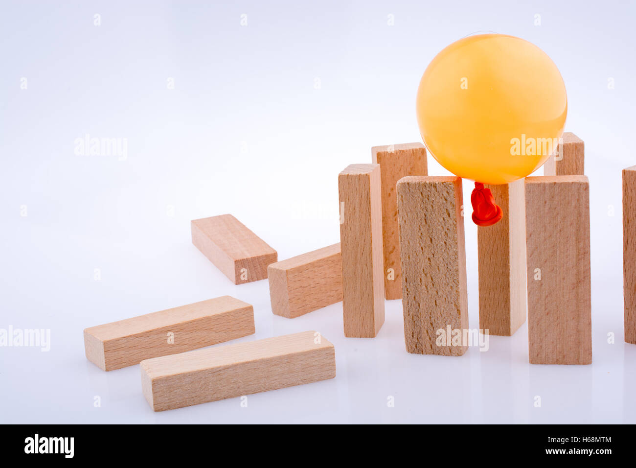 Balloon and domino pieces positioned on white background Stock Photo ...