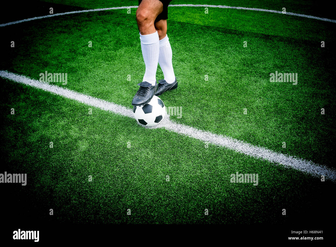 Soccer player ready to play at kick off point in soccer field Stock ...