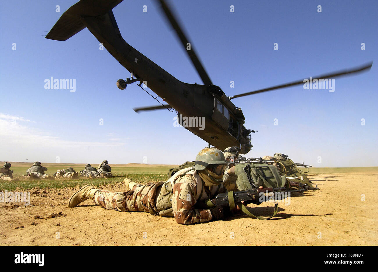 Iraqi army and U.S. Army soldiers secure a landing zone after departing ...