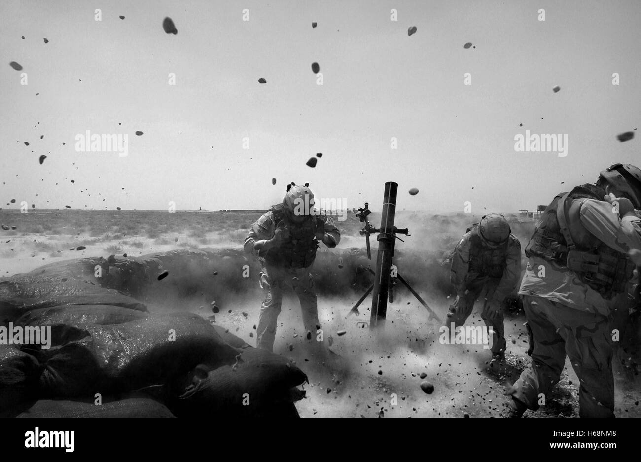 U.S. Army soldiers fire 120mm mortars at insurgent positions from ...