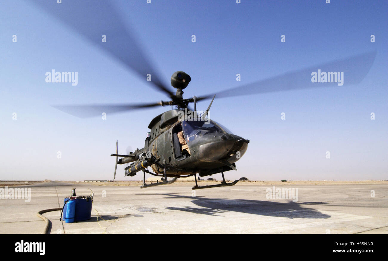 An OH-58D Kiowa Warrior helicopter takes off from Forward Operating ...