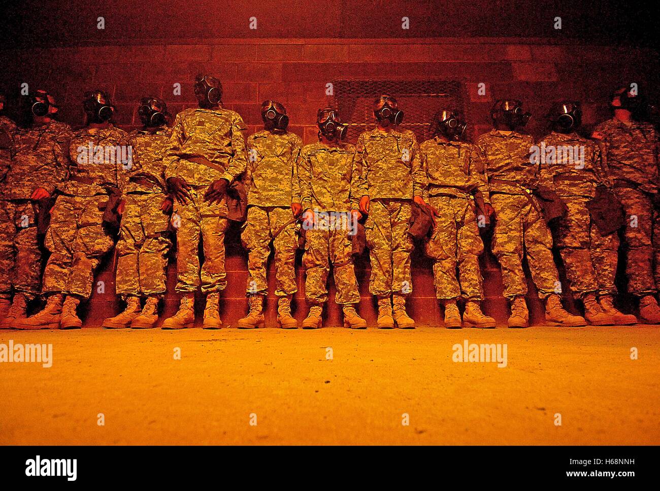 Soldiers going through U.S. Army basic training line the wall of the ...