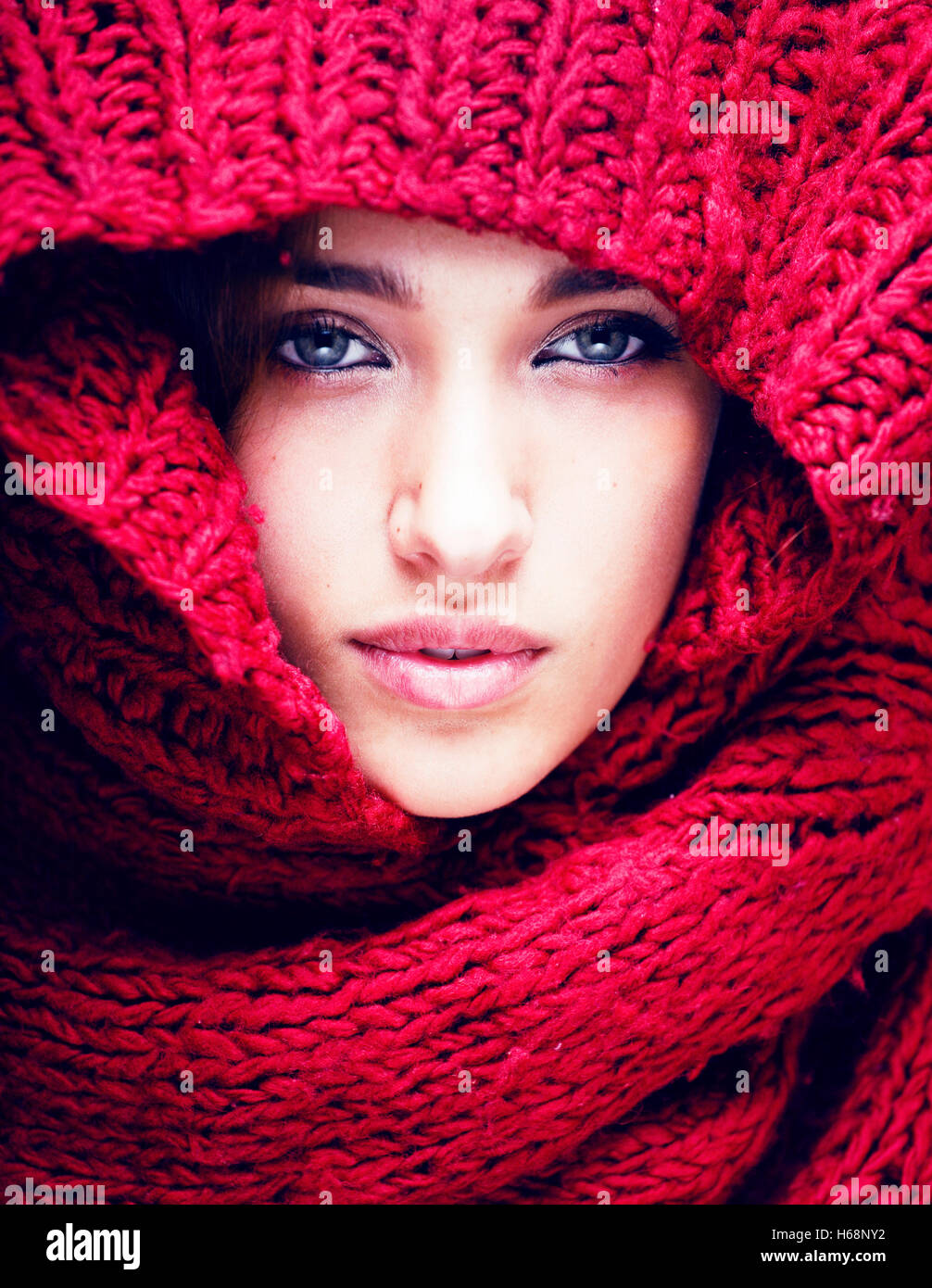 young pretty woman in sweater and scarf all over her face Stock Photo ...