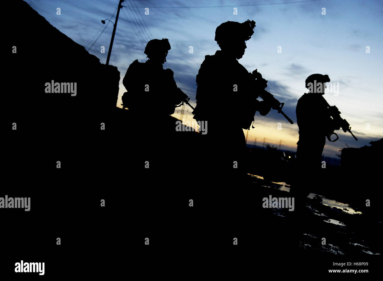 U.S. Army Soldiers provide an outer cordon of the village as Iraqi ...