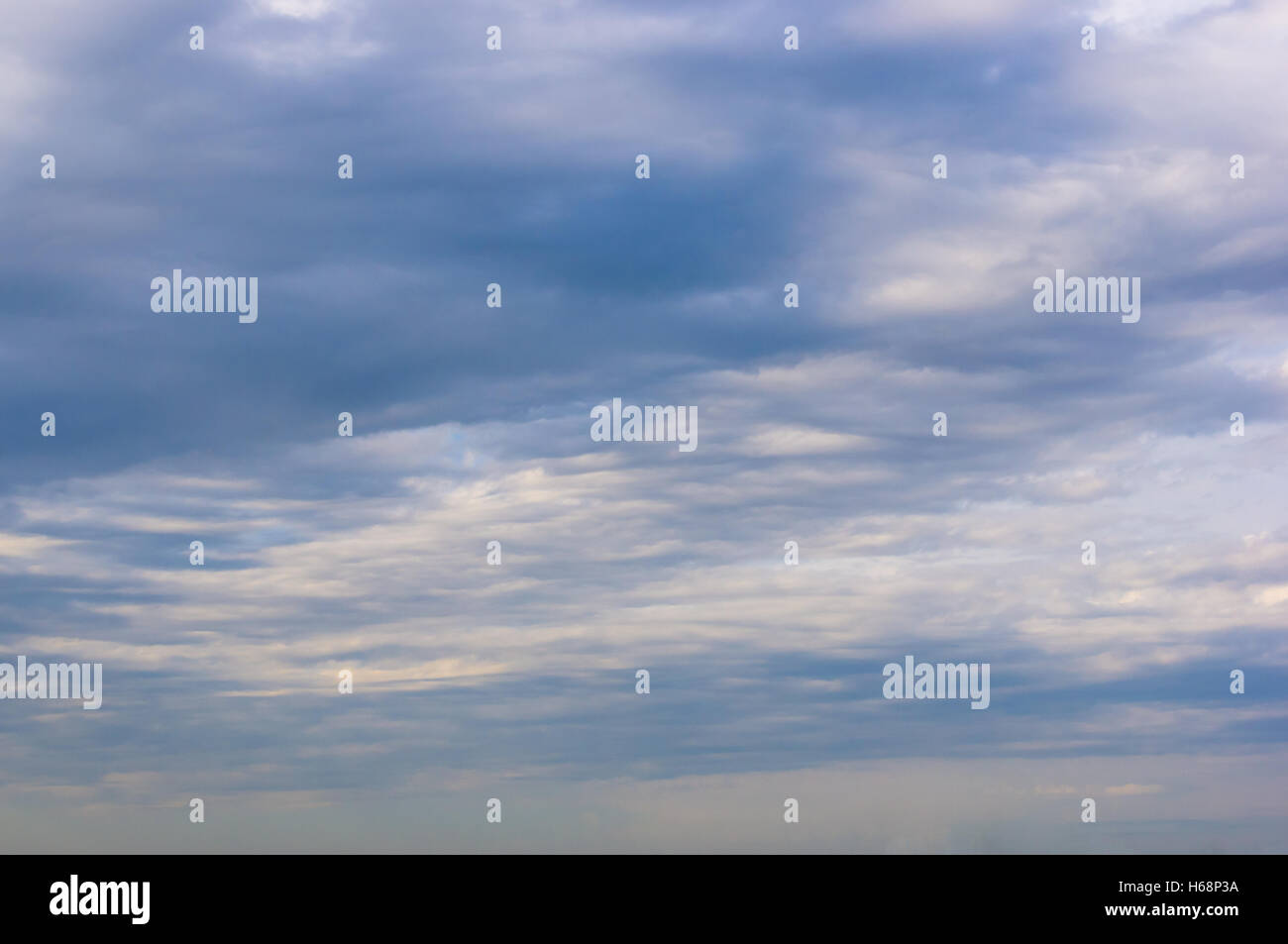 White clouds with sun rays in the blue summer sky Stock Photo - Alamy