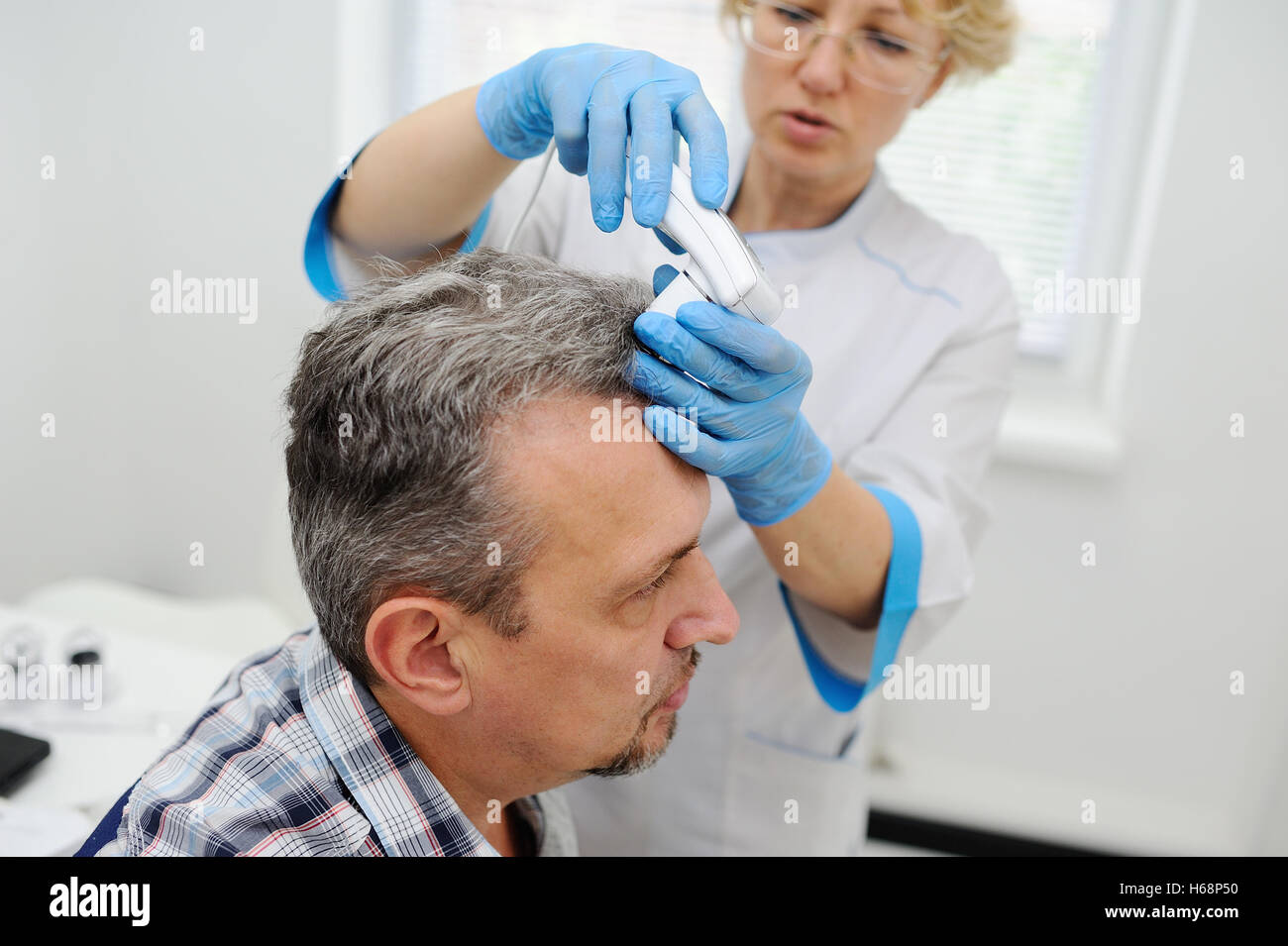 baldness. diagnostics hair and scalp Stock Photo - Alamy