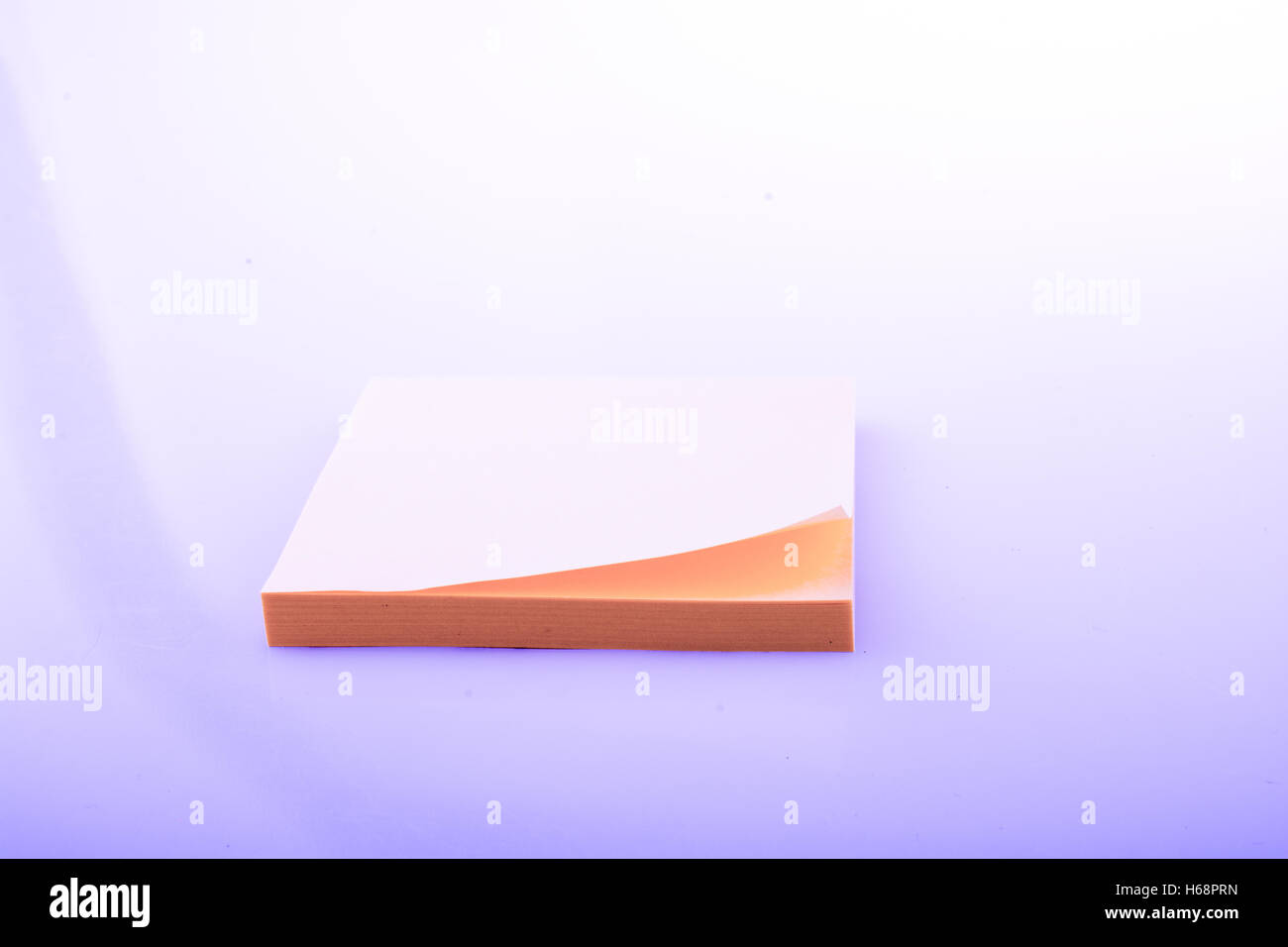 Block sticky paper of yellow color on a white background Stock Photo ...