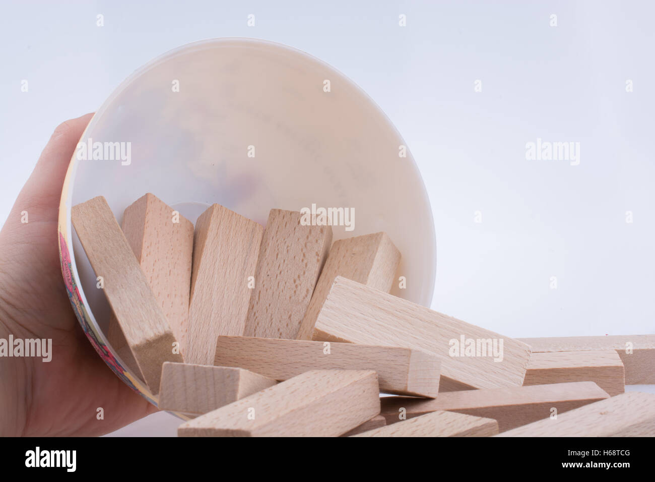 Hand playing with wooden building blocks on white background Stock ...