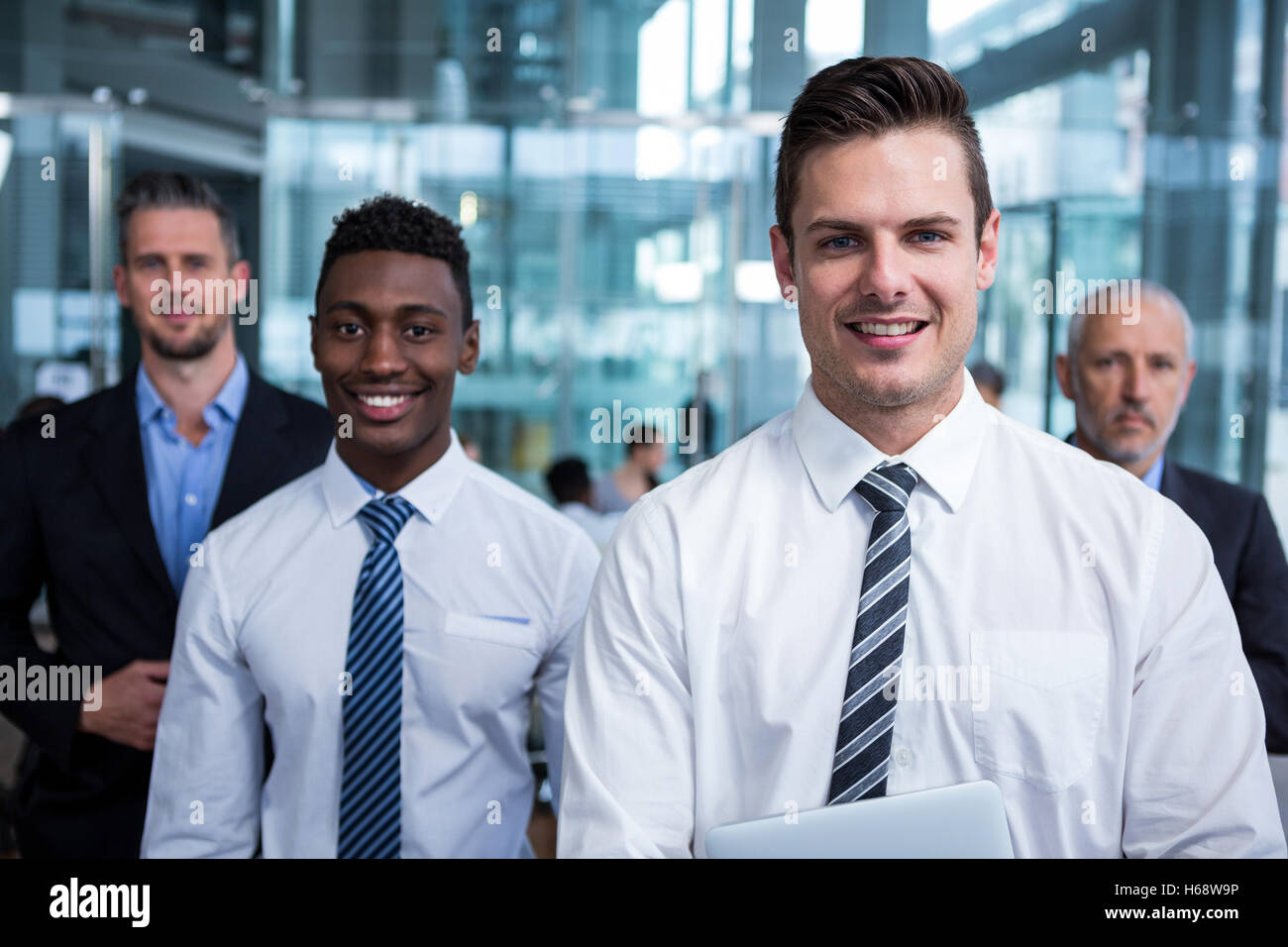 Portrait of businessmen in office Stock Photo - Alamy