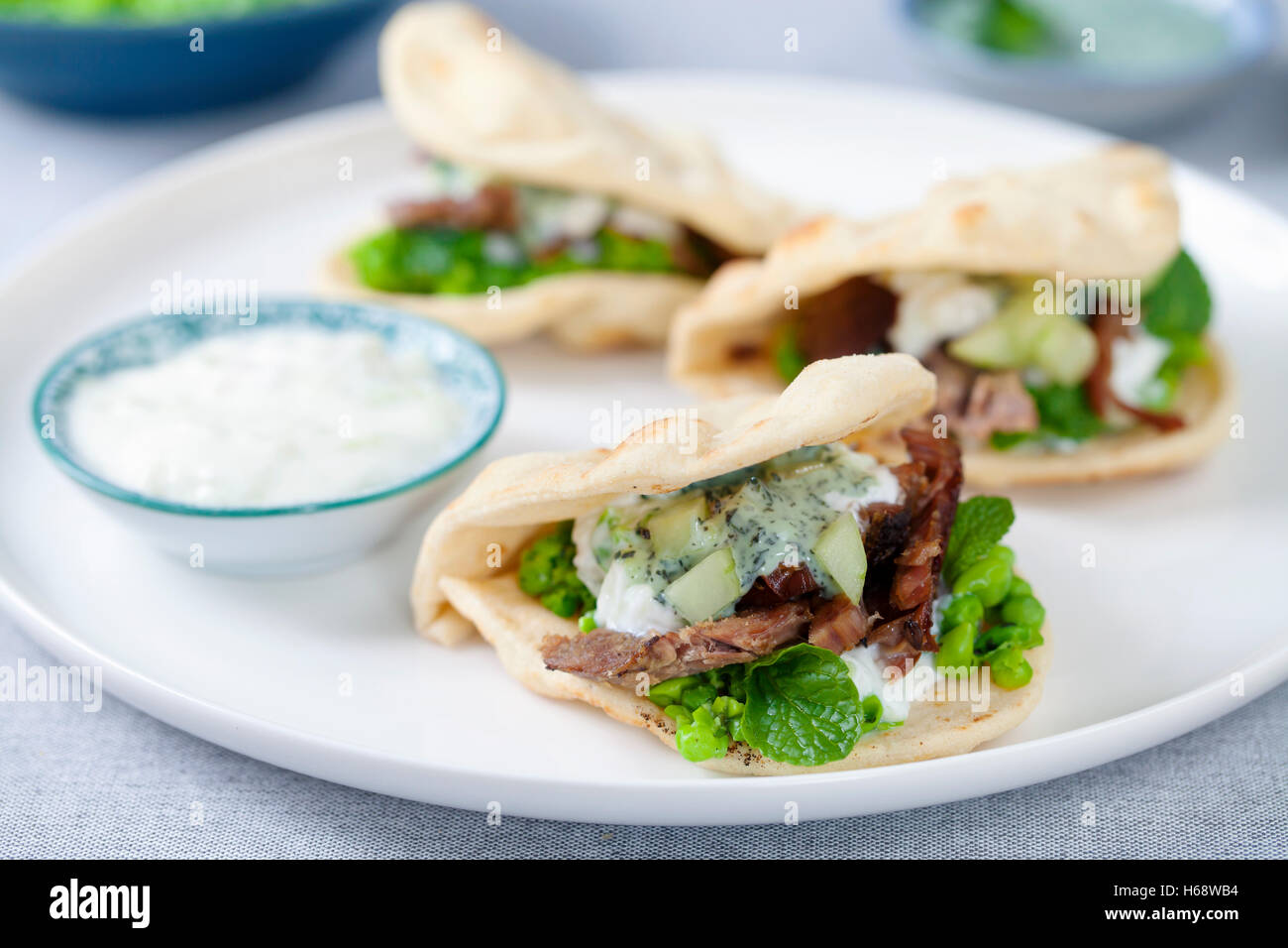 Mini flat breads with crispy lamb, mashed peas, cucumber, mint and ...