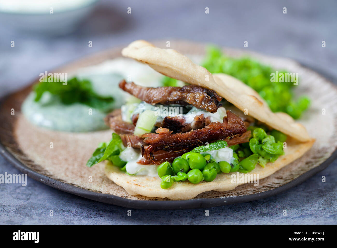 Mini flat breads with crispy lamb, mashed peas, cucumber, mint and ...