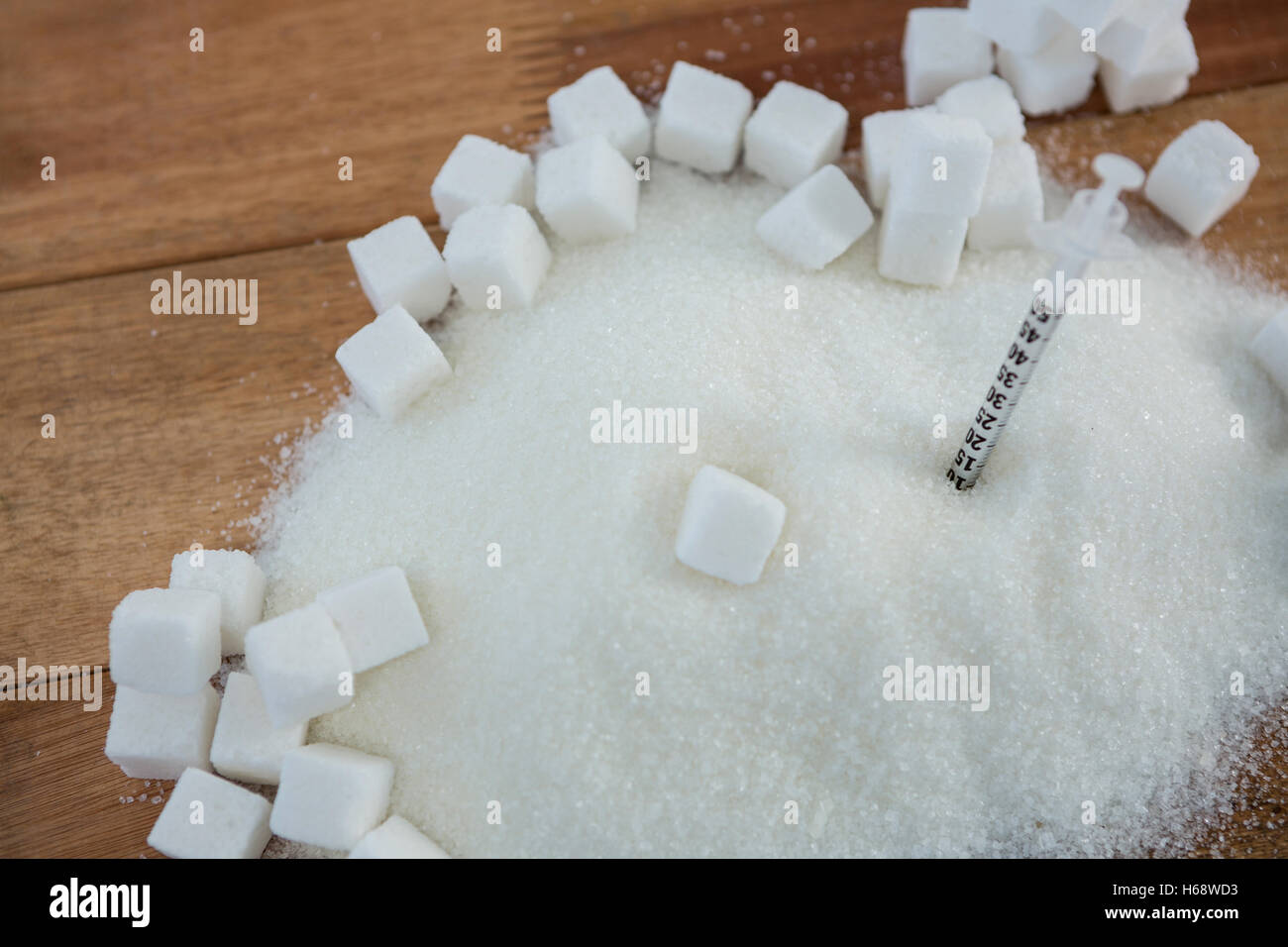 Syringe in sugar powder Stock Photo - Alamy