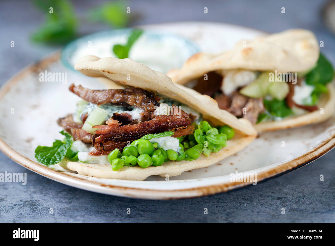 Mini flat breads with crispy lamb, mashed peas, cucumber, mint and ...