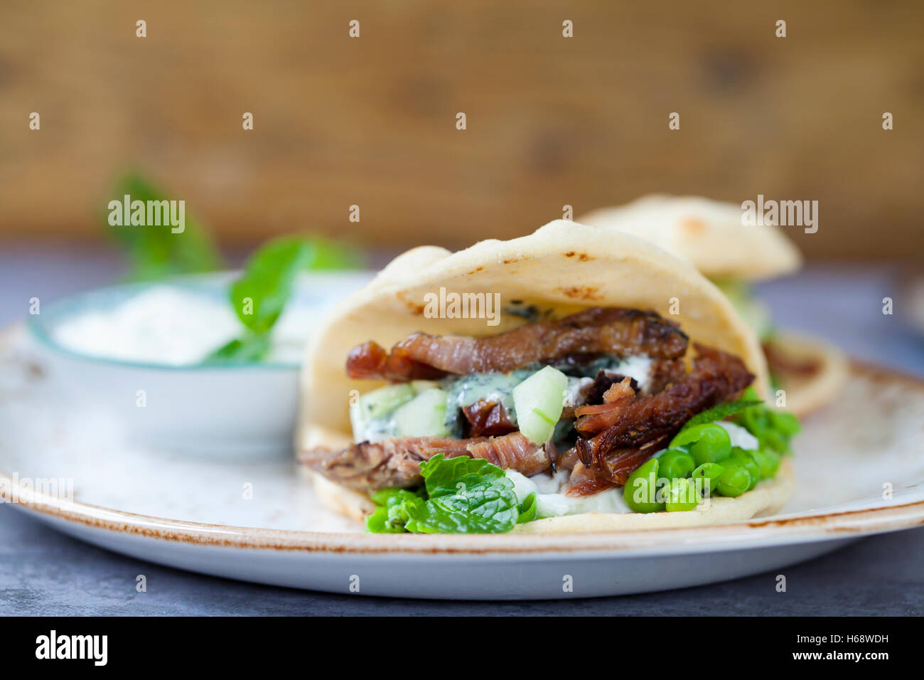 Mini flat breads with crispy lamb, mashed peas, cucumber, mint and ...