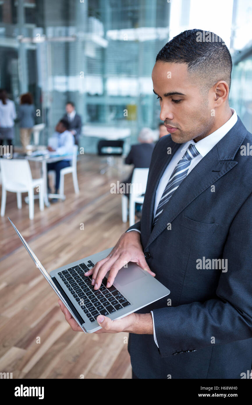 Businessman working on laptop Stock Photo - Alamy