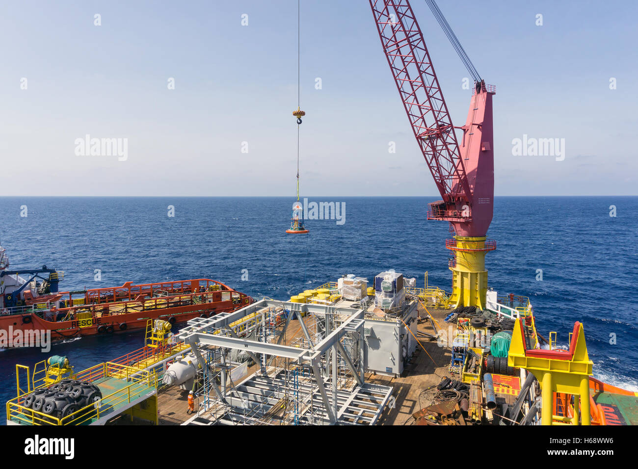 Offshore worker being lifted using personal transfer basket from ...