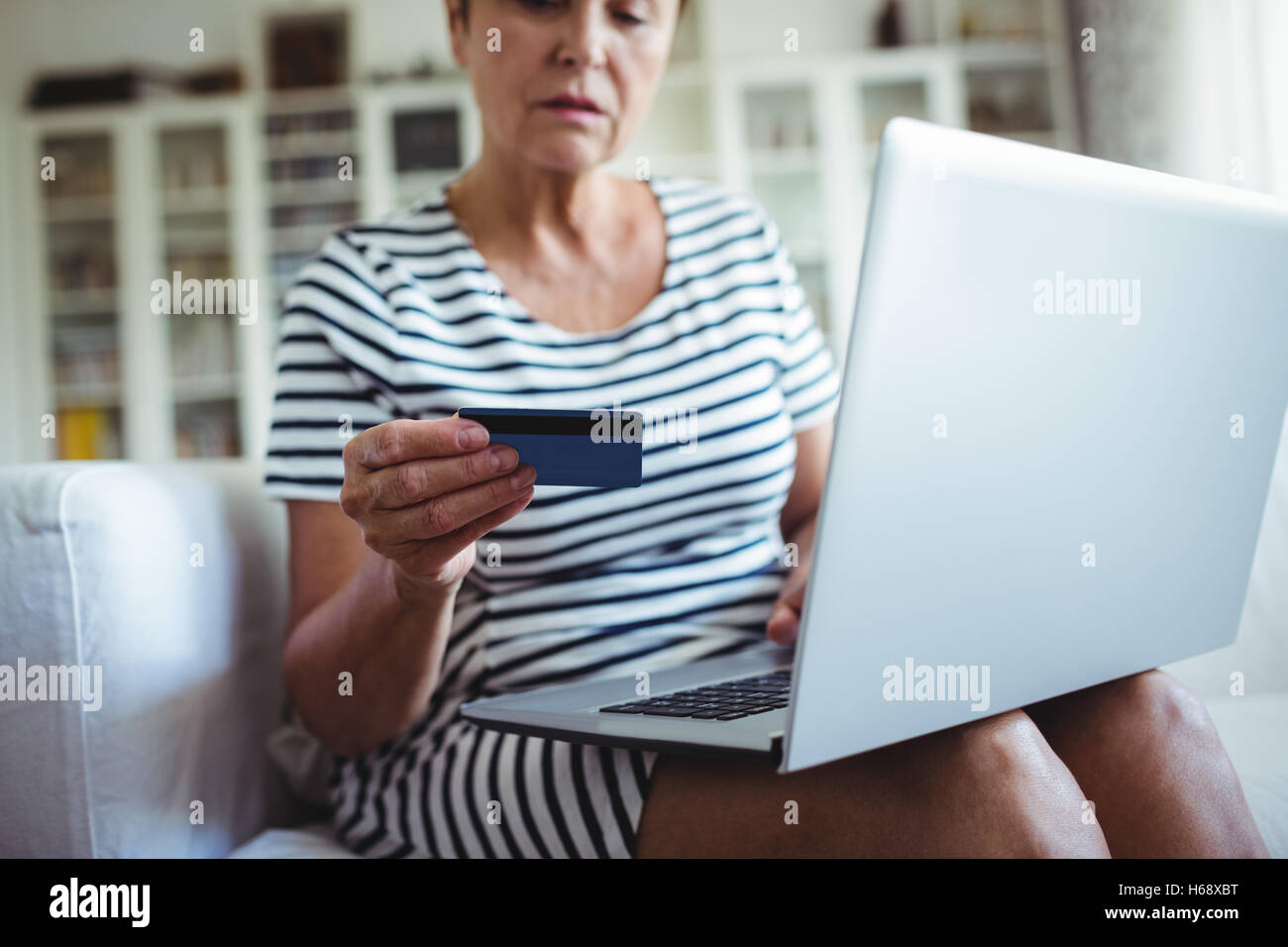 Senior woman doing online shopping on laptop Stock Photo - Alamy