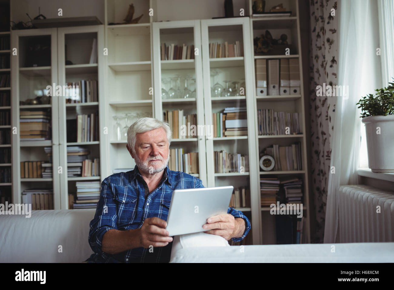 Senior man using digital tablet Stock Photo - Alamy Senior man using digital tablet Stock Photo - Alamy