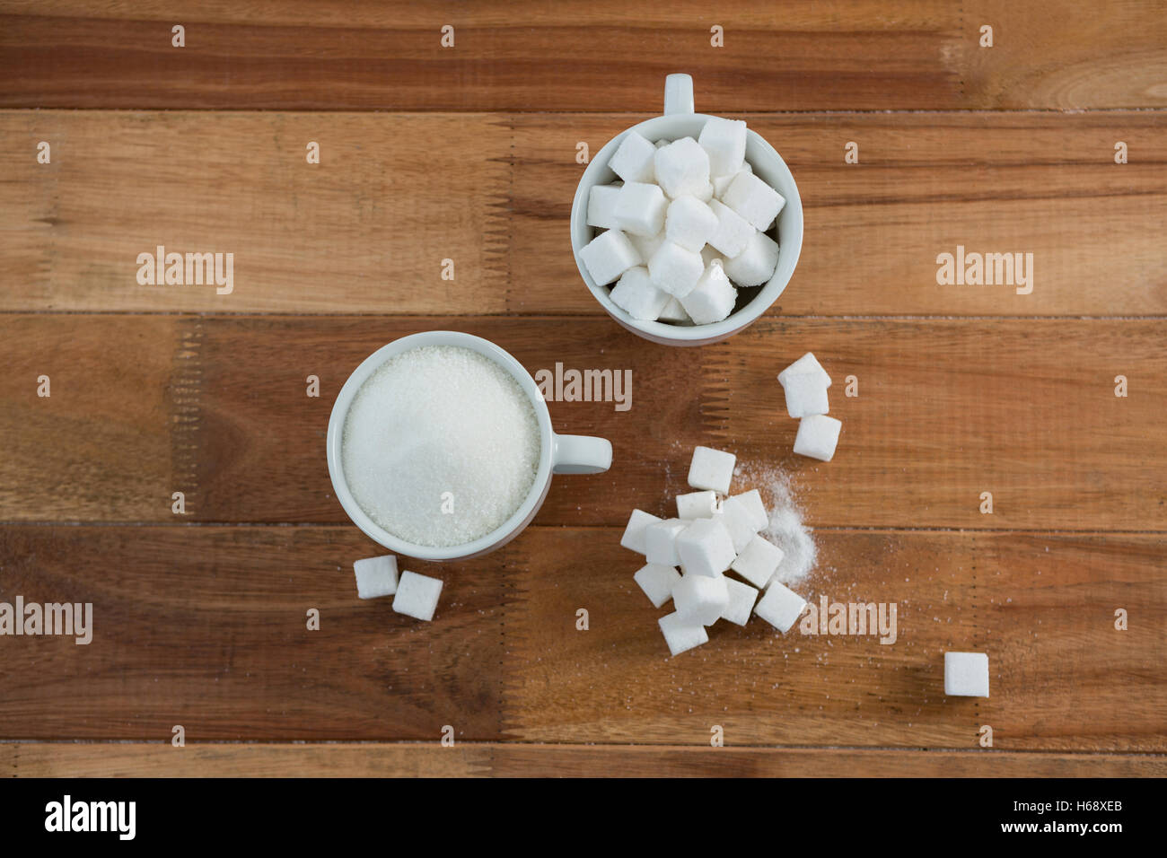 Cup of sugar powder and sugar cube Stock Photo - Alamy