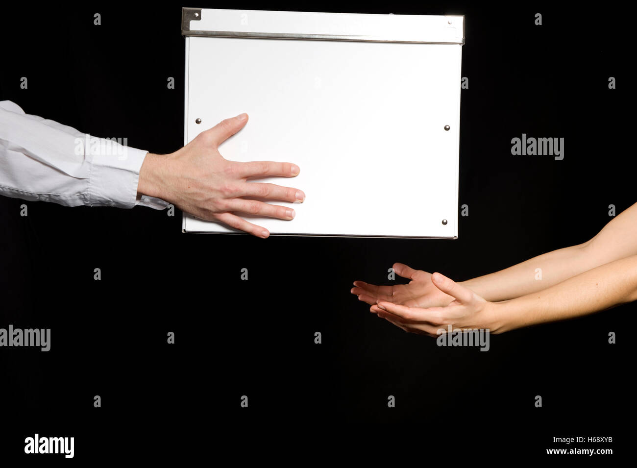 Box being handed over Stock Photo - Alamy