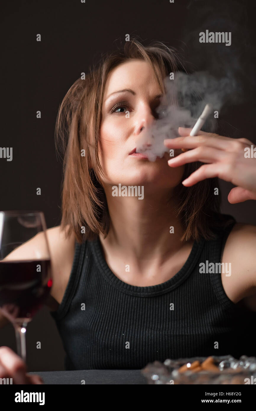 Woman drinking glass wine cigarette hi-res stock photography and images ...