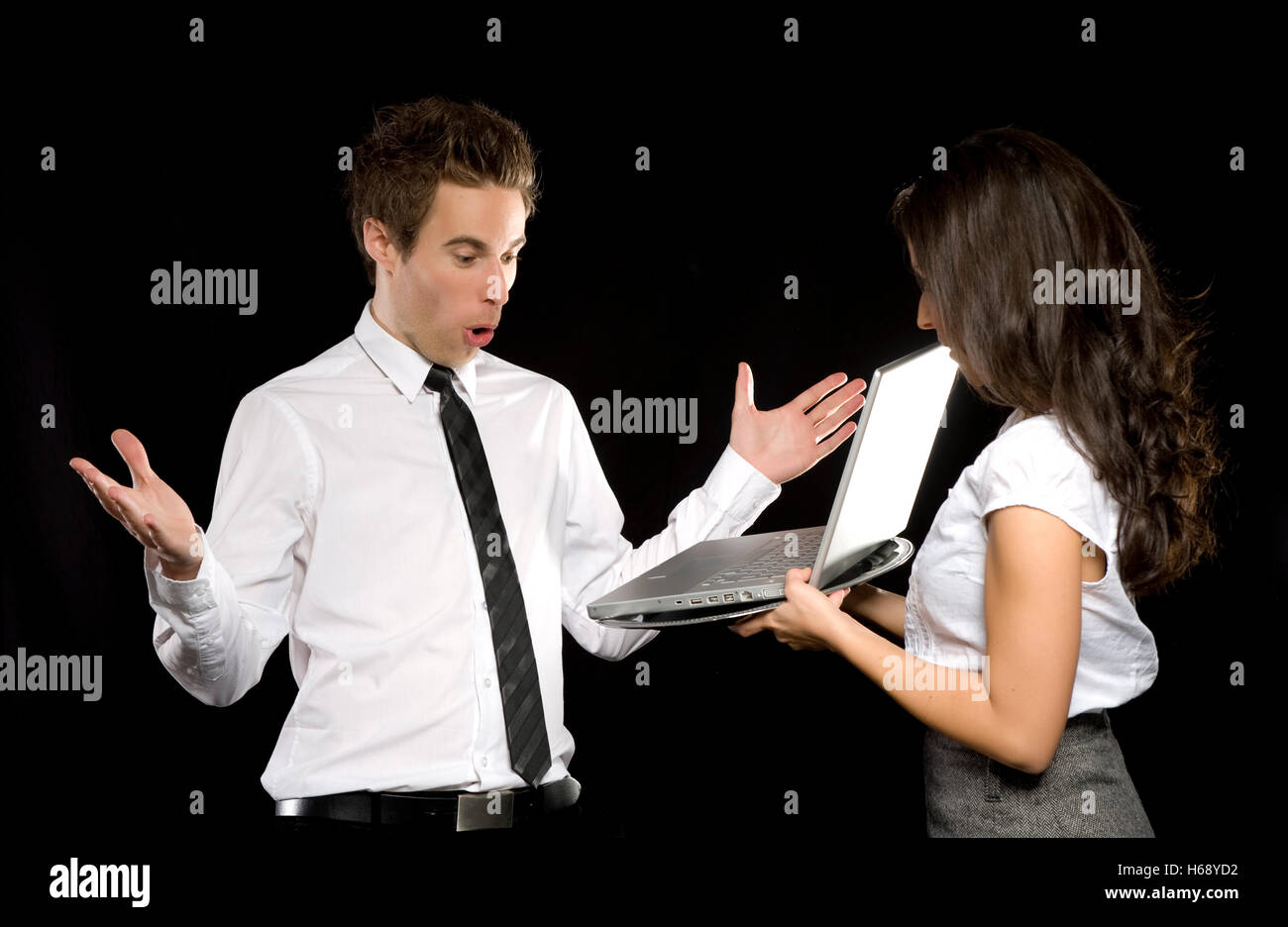 Two business people with laptop Stock Photo - Alamy