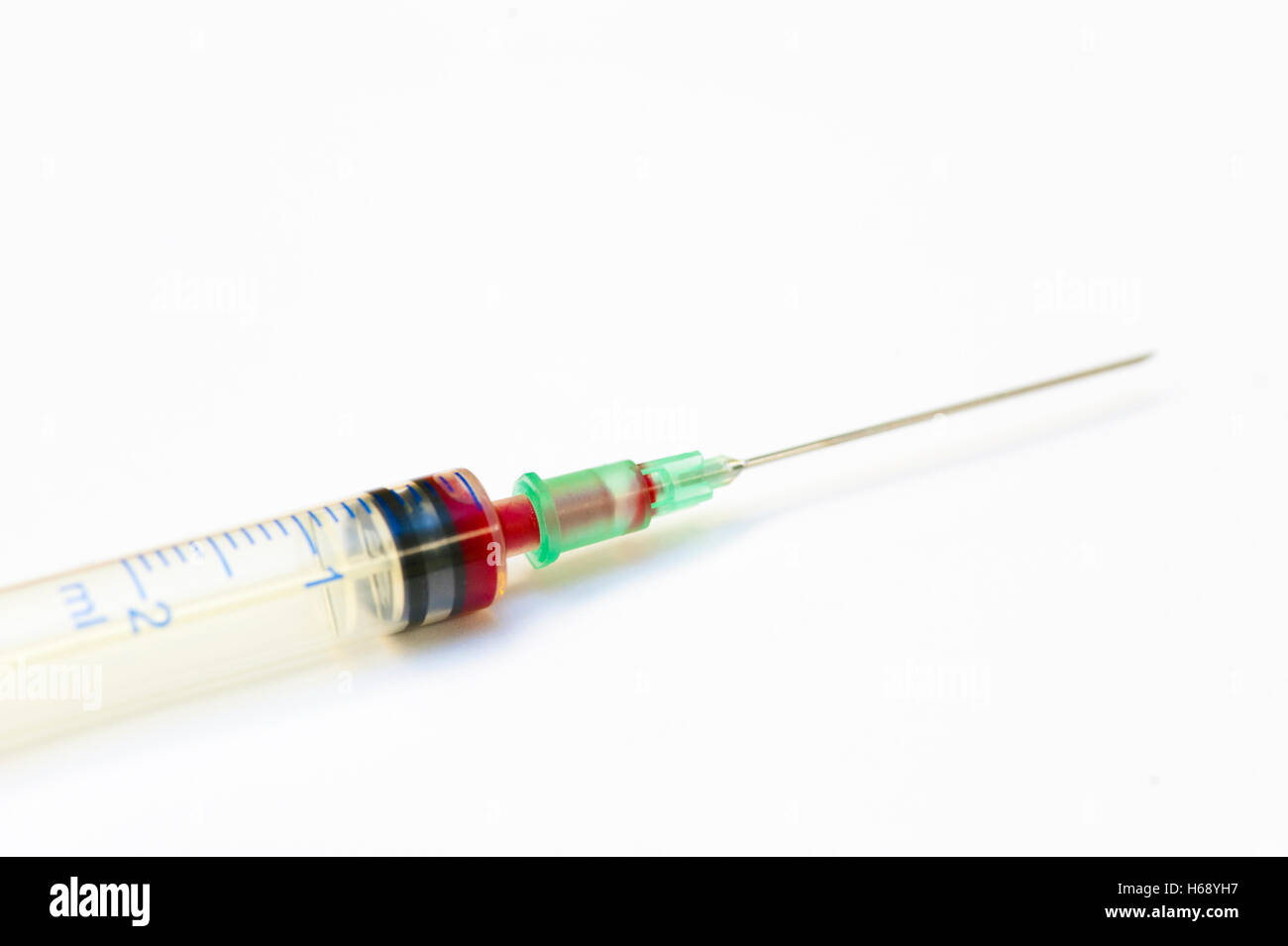Syringe with needle and blood Stock Photo - Alamy