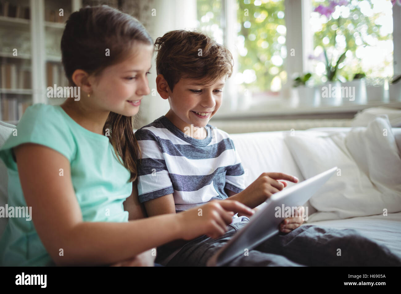 Children using digital tablet Stock Photo - Alamy