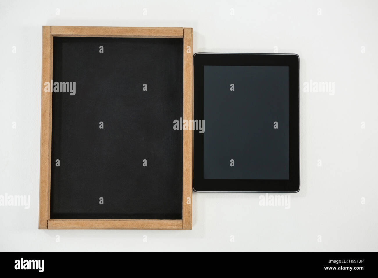 Digital tablet and slate on white background Stock Photo - Alamy