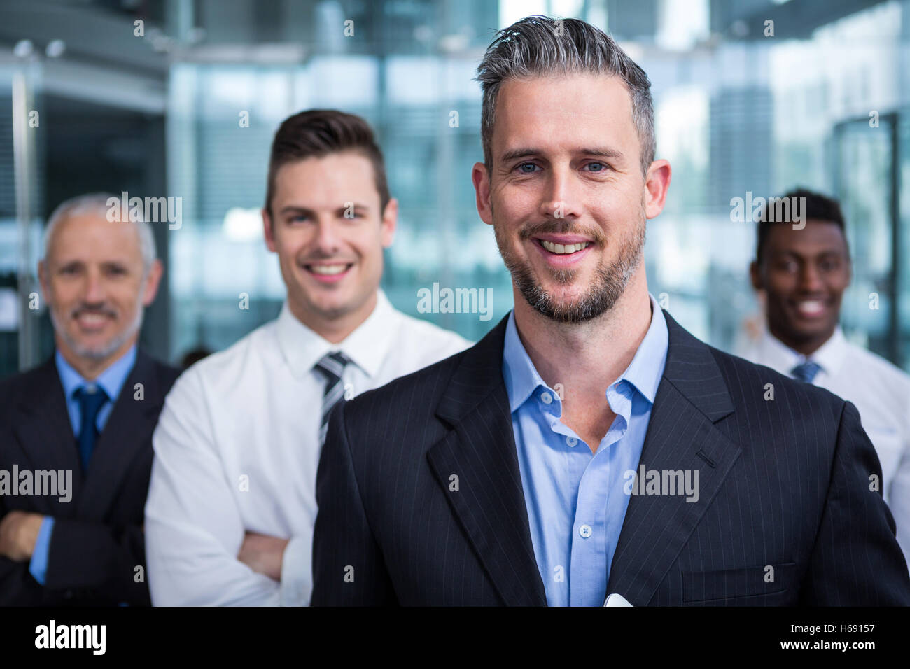 Portrait of businessmen in office Stock Photo - Alamy