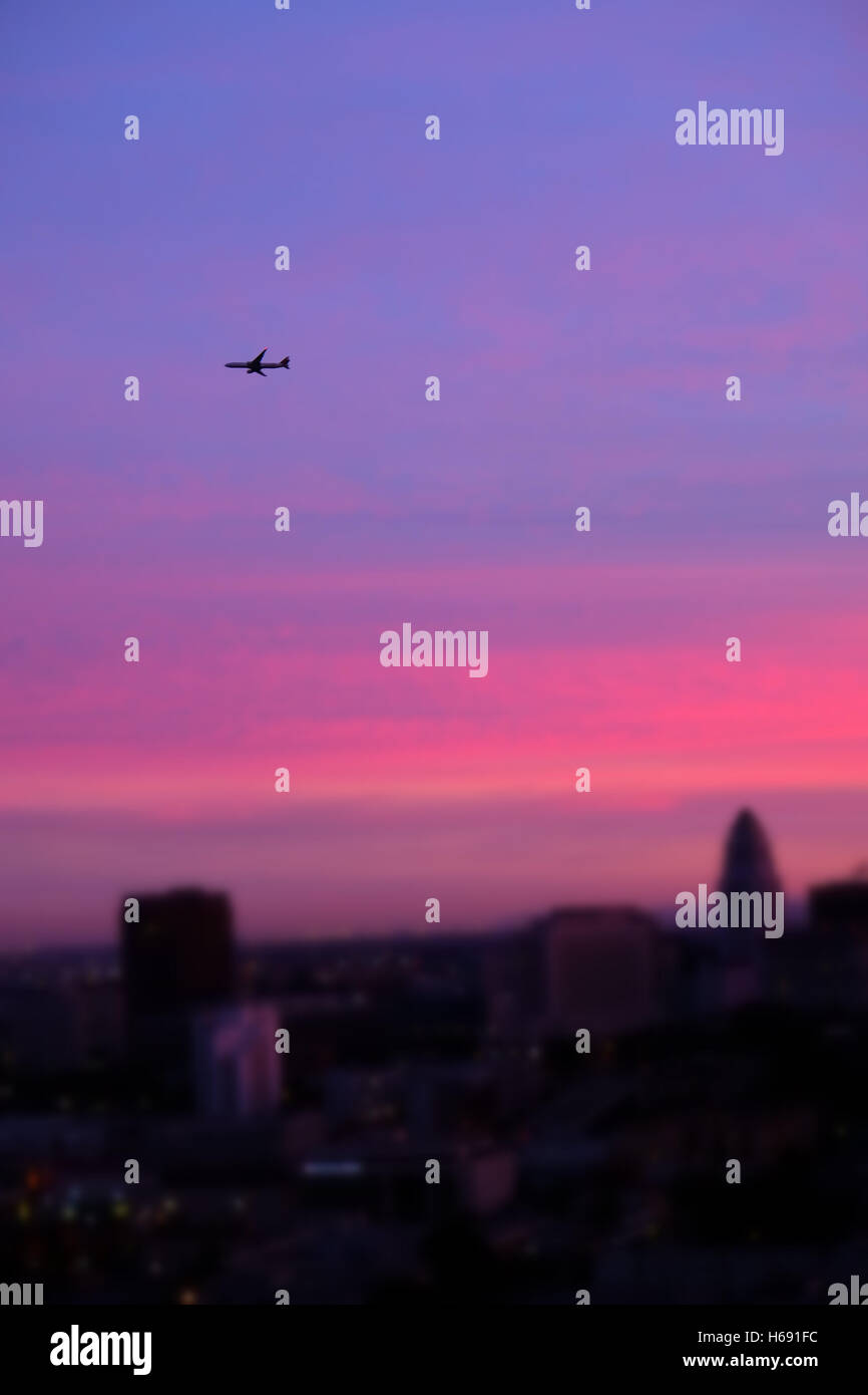 Airplane flying over Los Angeles during a beautiful sunset Stock Photo ...