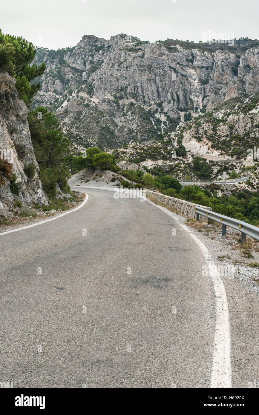 Road in the mountain. Dramatic scene Stock Photo - Alamy