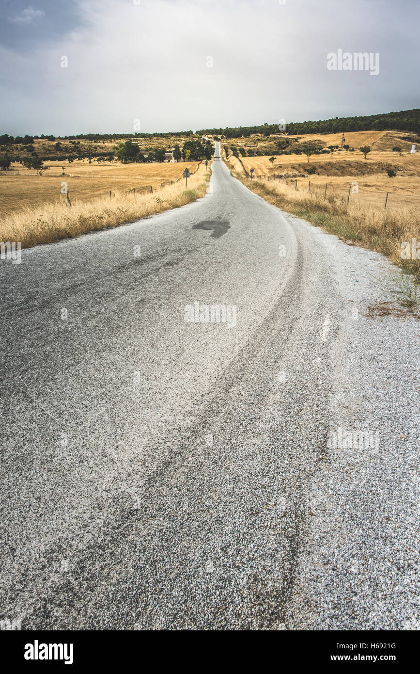 Road and dramatic cloudy sky Stock Photo - Alamy