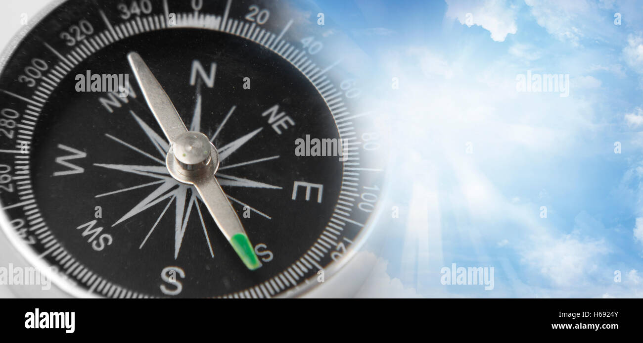 Compass in a blue sky Stock Photo - Alamy