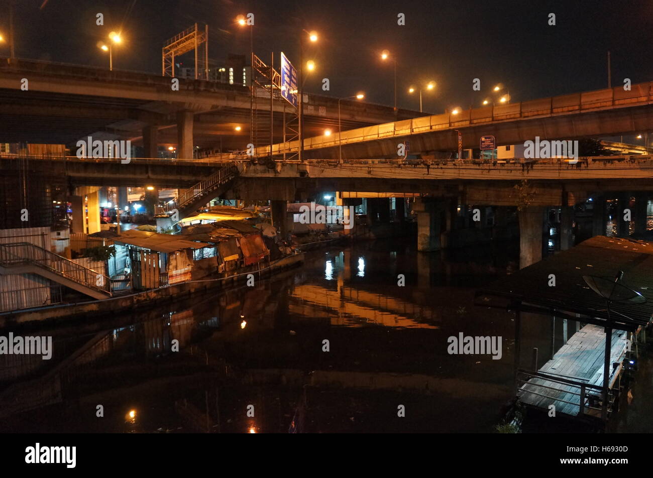 A slum under several highways in On Nut district, Bangkok, Thailand ...