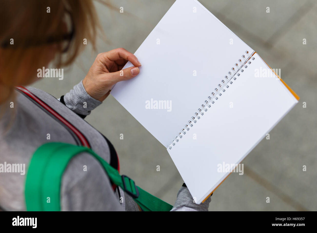 Girl student holds book hi-res stock photography and images - Alamy