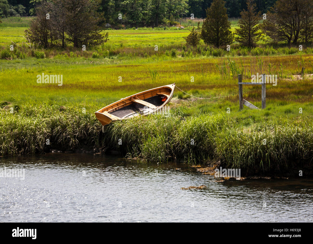 Docked vintage rowboat on a lake bank, Stowe, Vermont, New England row ...