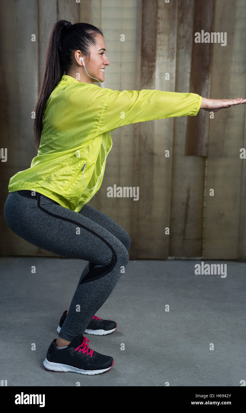 Athlete doing wall squat against hi-res stock photography and images ...