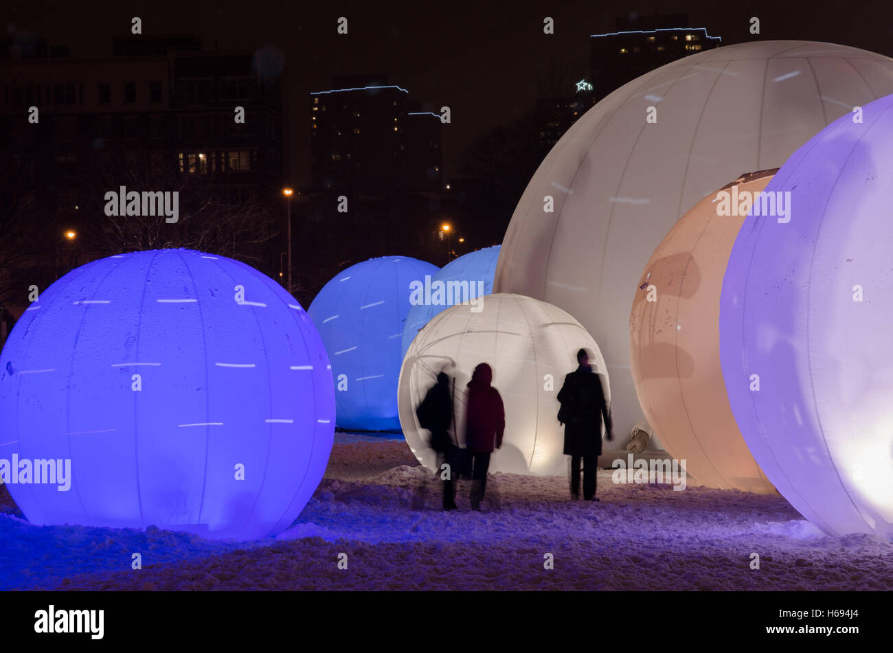People by big colored balls Stock Photo - Alamy