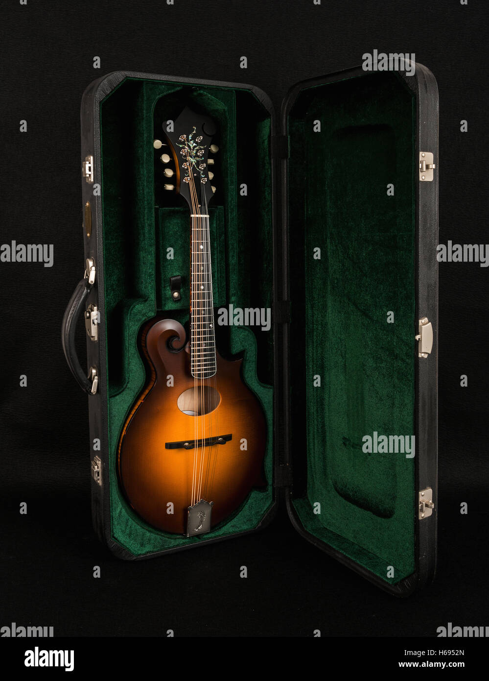 Mandolin in a black case on a dark background, Mandolin F4 Stock Photo ...