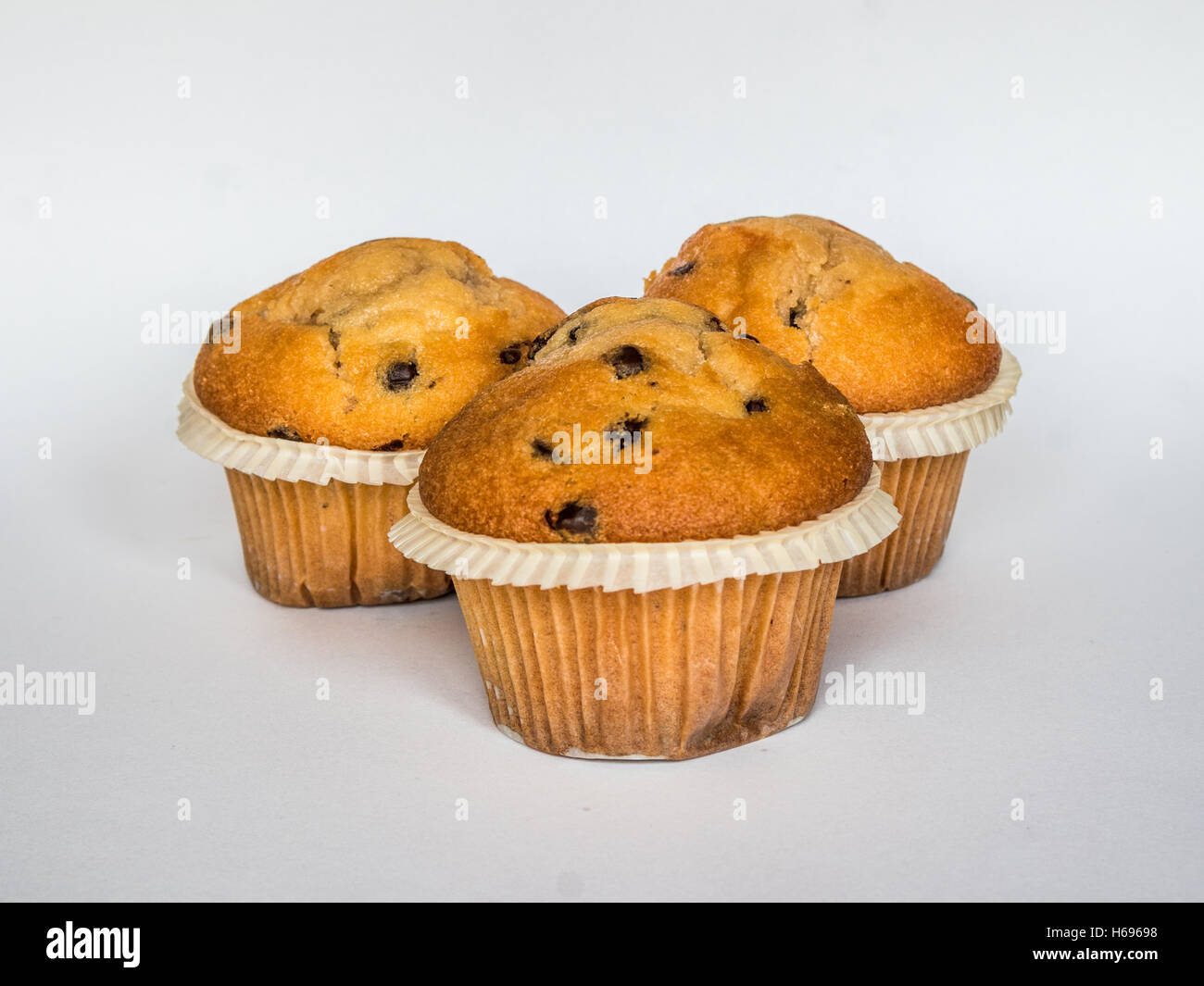 three muffins of a white background Stock Photo - Alamy