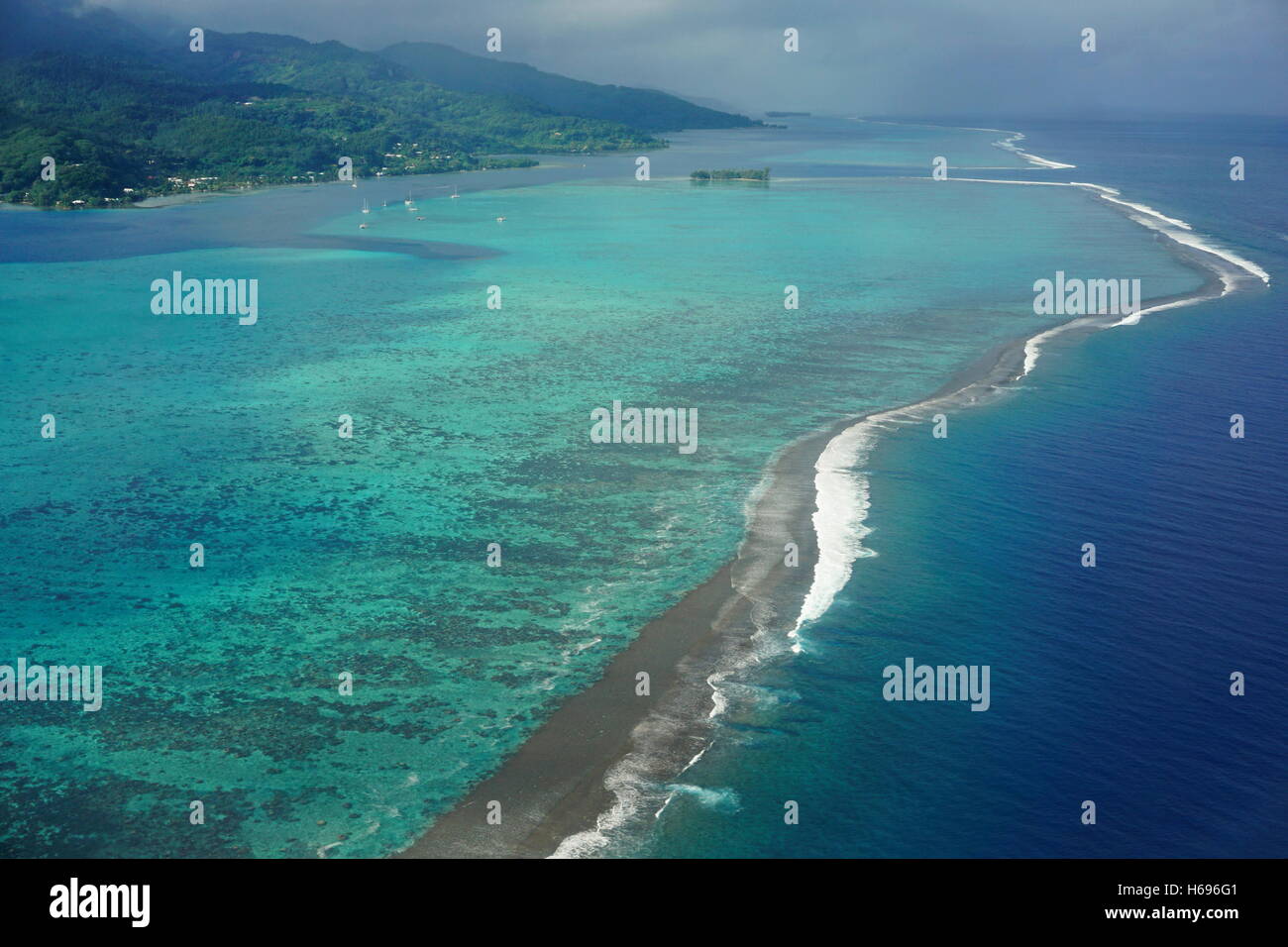 Aerial view of tropical lagoon and coral barrier reef of Raiatea island ...